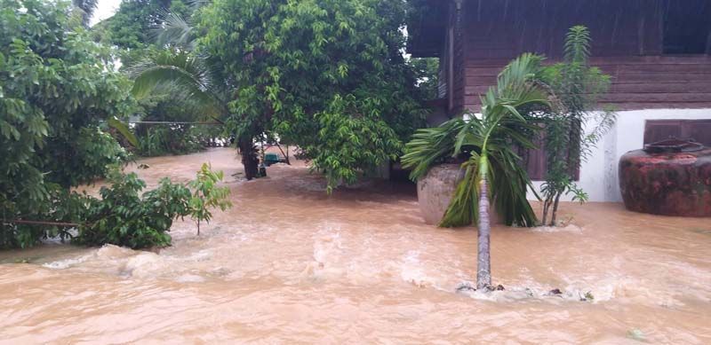 Torrential rain triggers heavy flooding, washes out key road - Thai ...